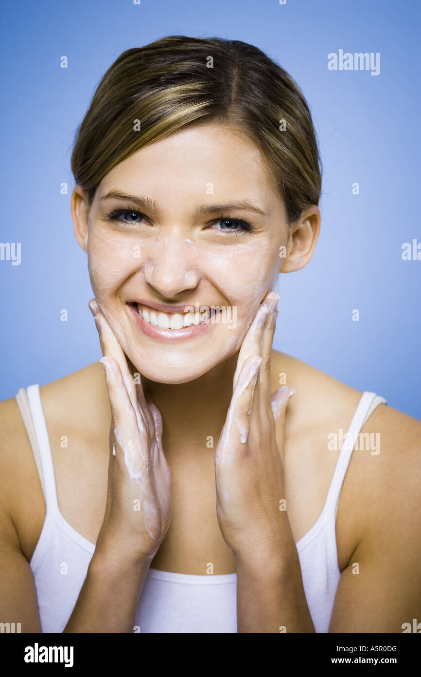 Woman washing face Stock Photo - Alamy