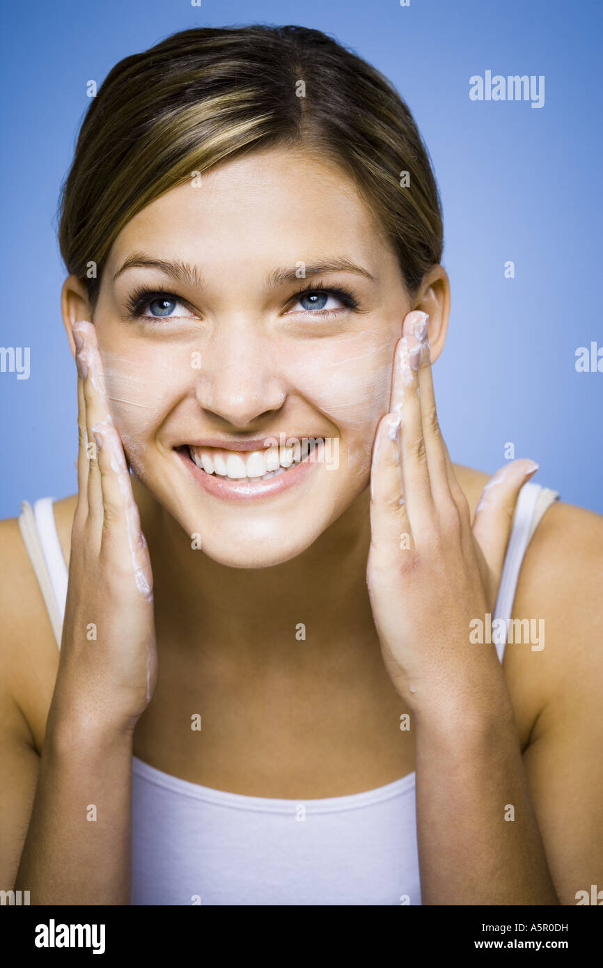 Woman washing face Stock Photo - Alamy