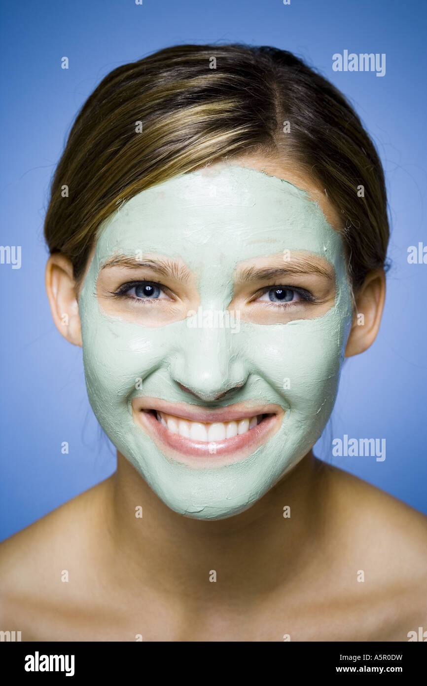 Woman with facial mask smiling Stock Photo - Alamy