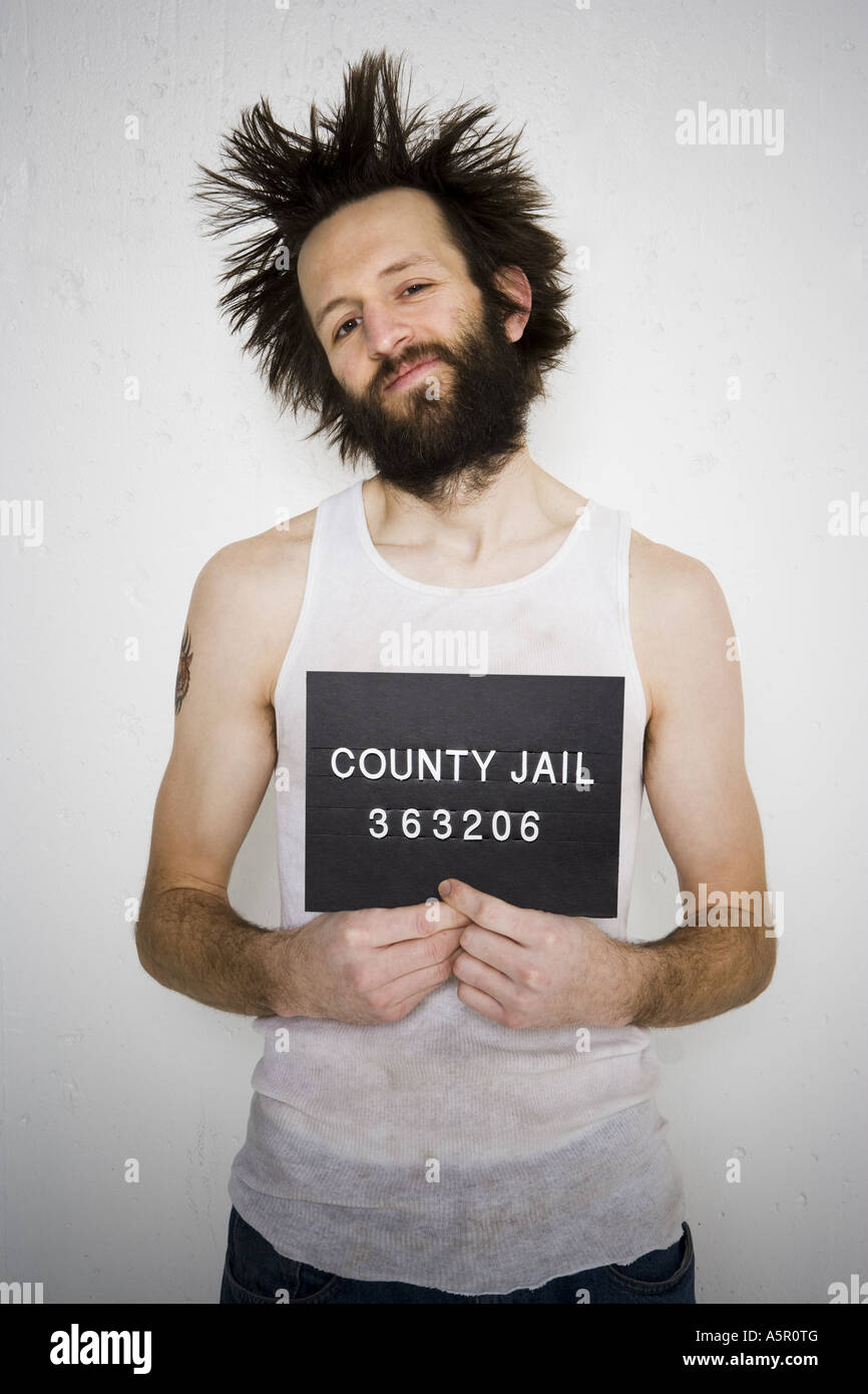 Mug shot of man with cigarette and beer bottle Stock Photo - Alamy