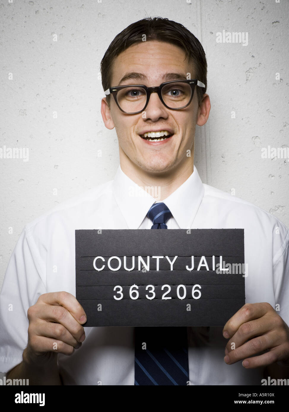 Mug shot of nerd with glasses Stock Photo - Alamy