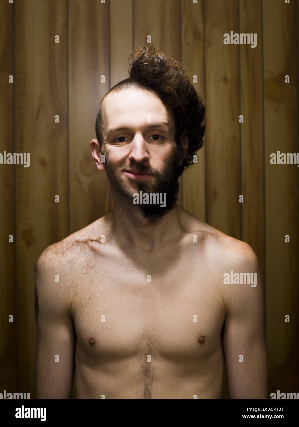 Man with half shaved head and beard half smiling Stock Photo - Alamy