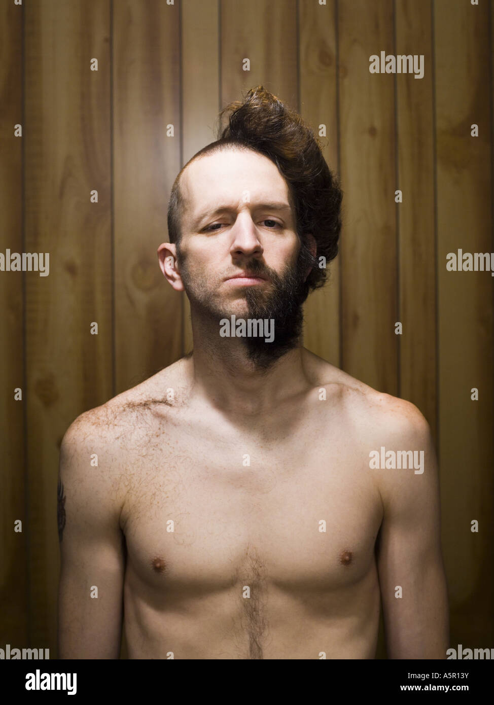 Man with half shaved head and beard half smiling Stock Photo - Alamy