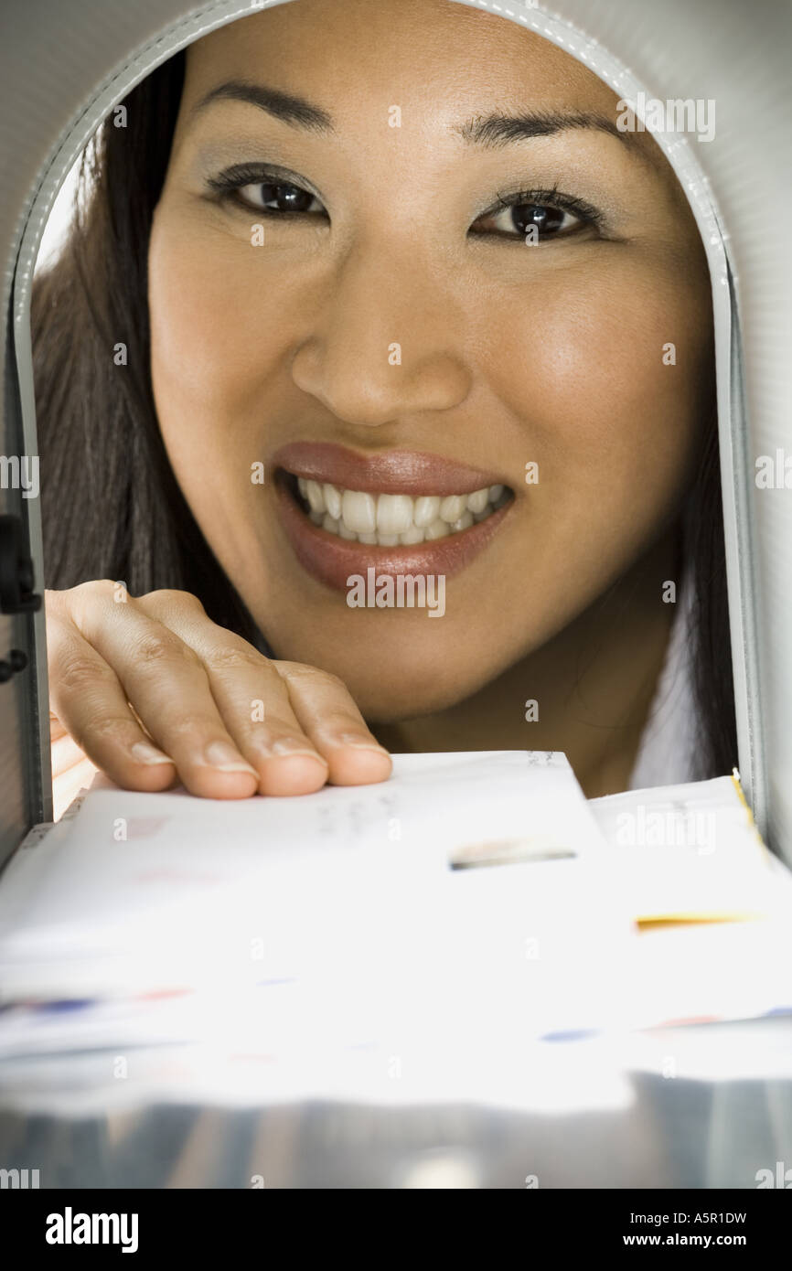 Woman mailbox looking at camera hi-res stock photography and images - Alamy