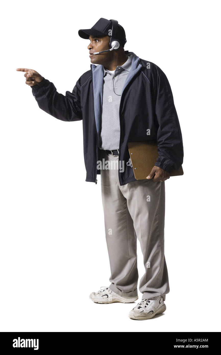 Coach pointing at mobile phone hi-res stock photography and images - Alamy
