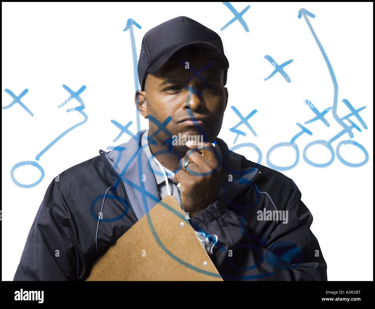 Coach looking at strategy Stock Photo - Alamy