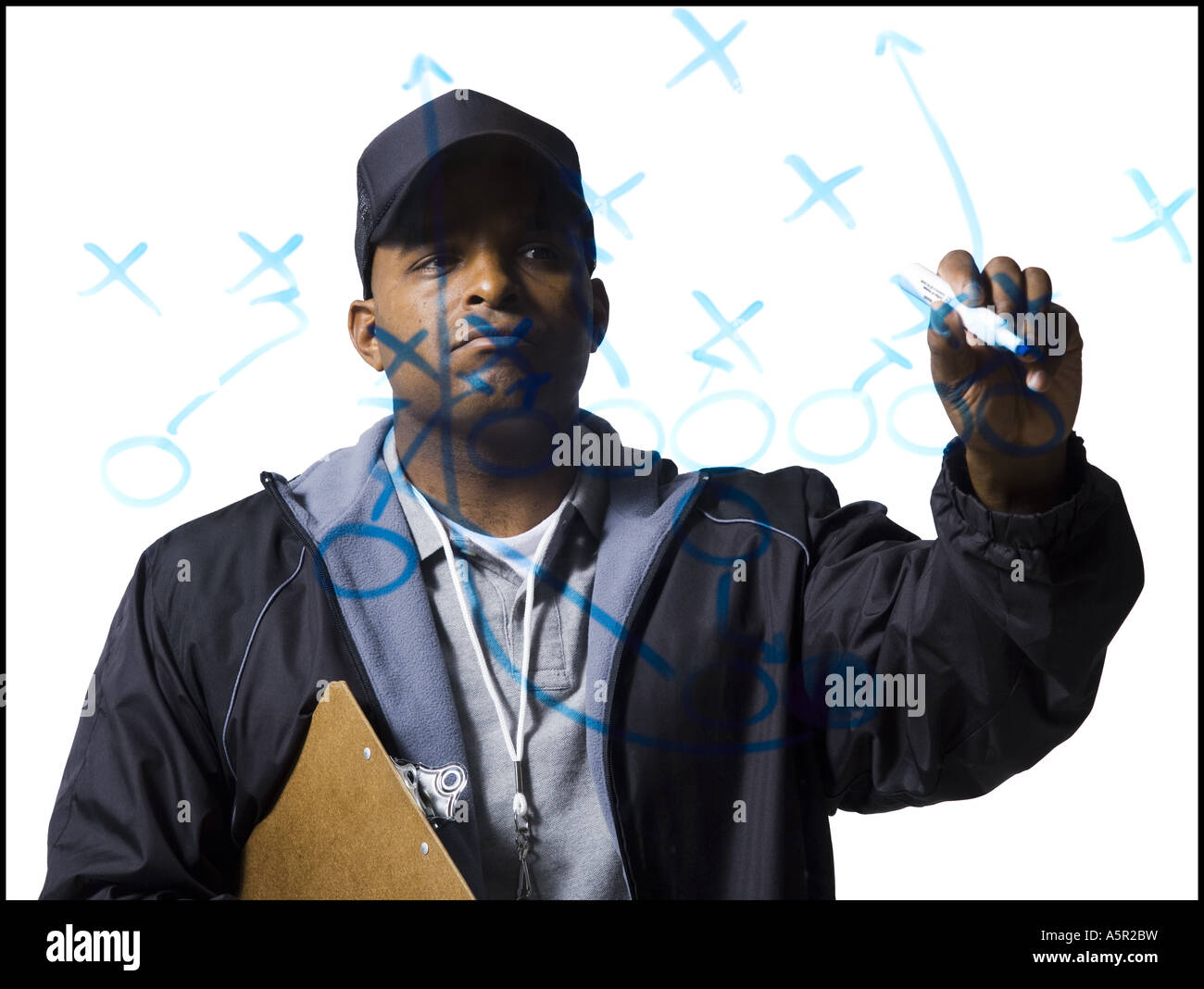 Coach looking at strategy Stock Photo - Alamy