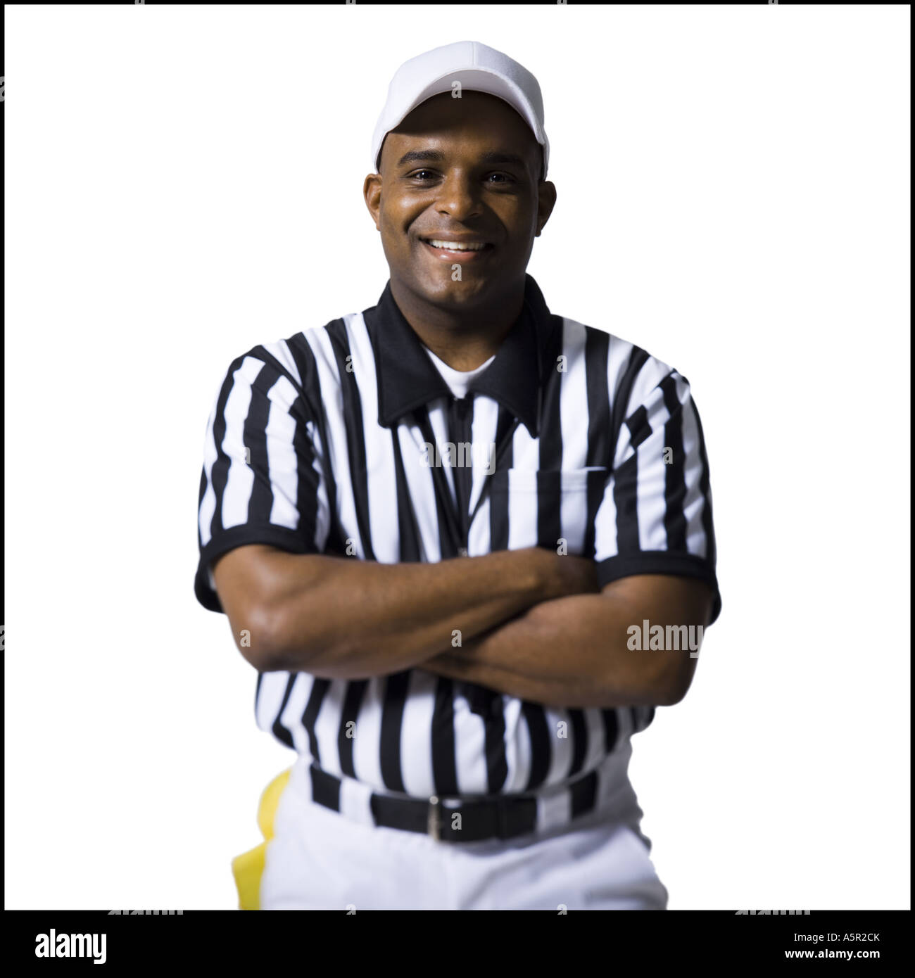 Referee standing with arms crossed Stock Photo - Alamy