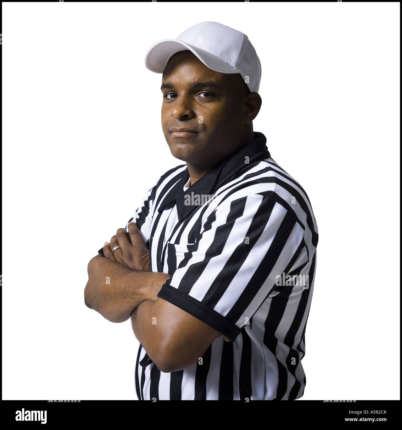 Referee standing with arms crossed Stock Photo - Alamy