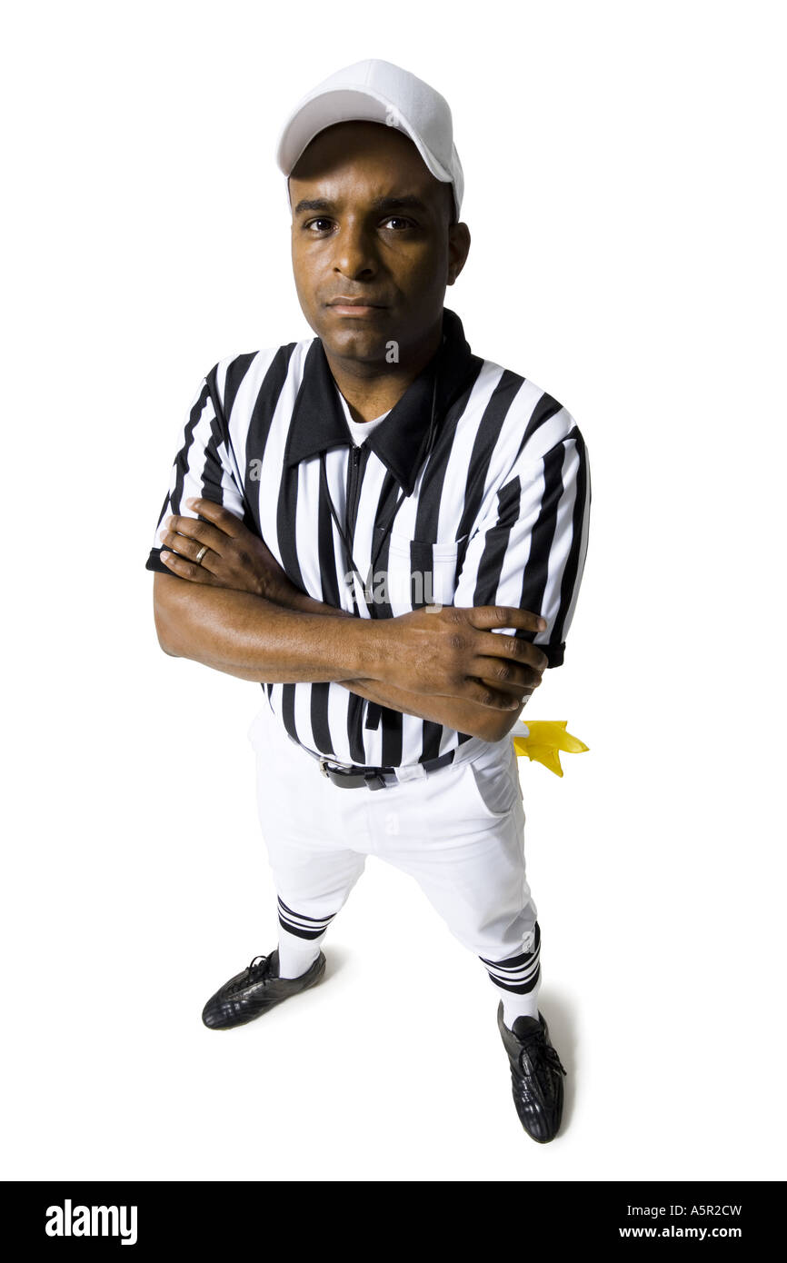 Referee standing with arms crossed Stock Photo - Alamy