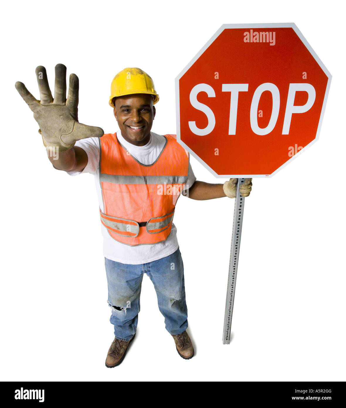 Road worker with stop sign and hardhat Stock Photo - Alamy