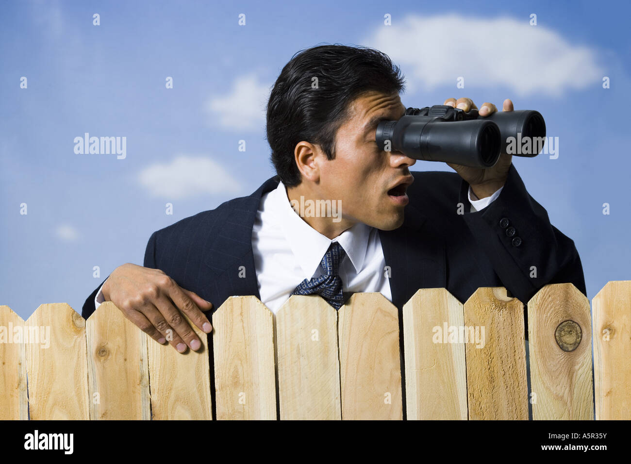 Man watching over fence hi-res stock photography and images - Alamy