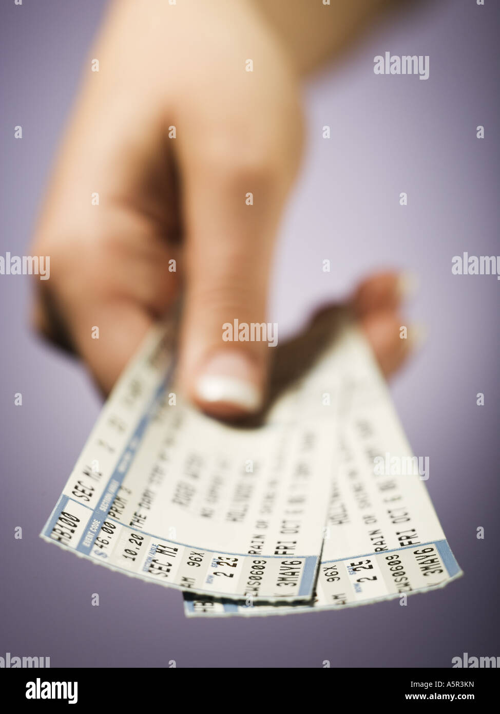 Woman giving tickets Stock Photo - Alamy