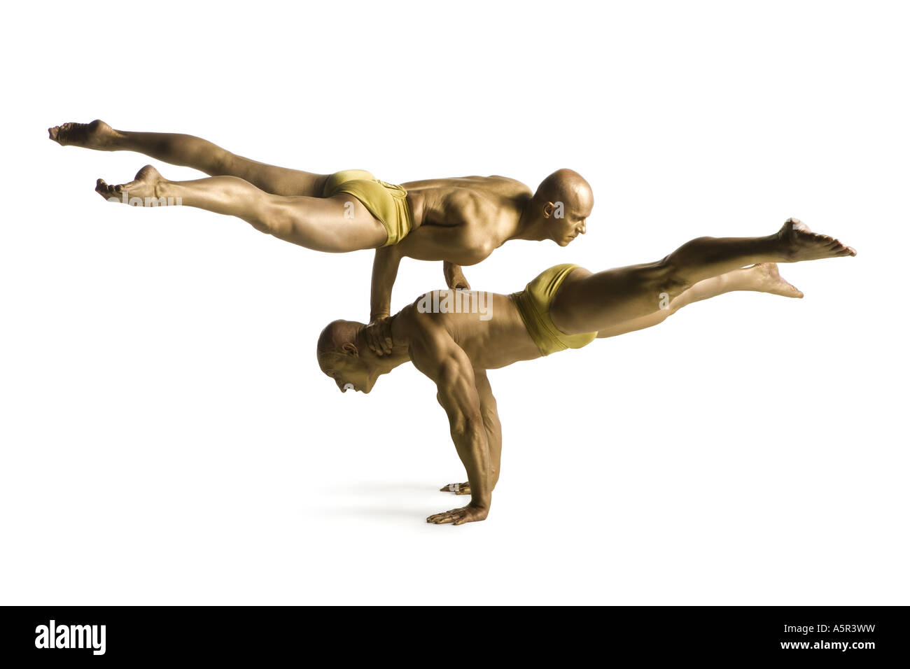 Profile of two male acrobats performing Stock Photo - Alamy