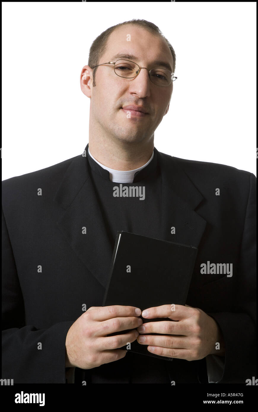 Male priest with bible Stock Photo - Alamy