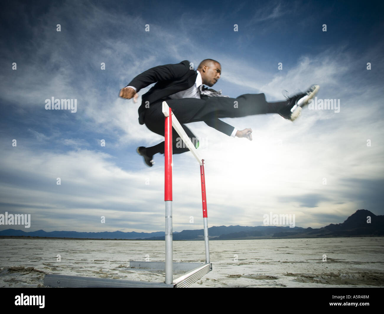 Businessman Jumping Over Hurdle High Resolution Stock Photography and ...