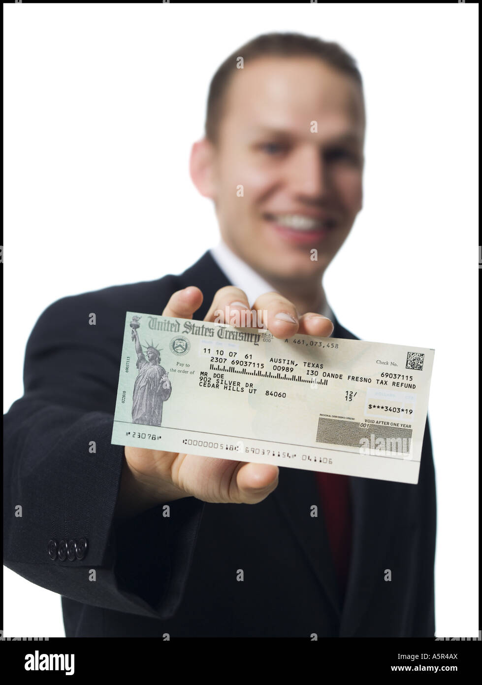 Businessman holding US Treasury check Stock Photo - Alamy