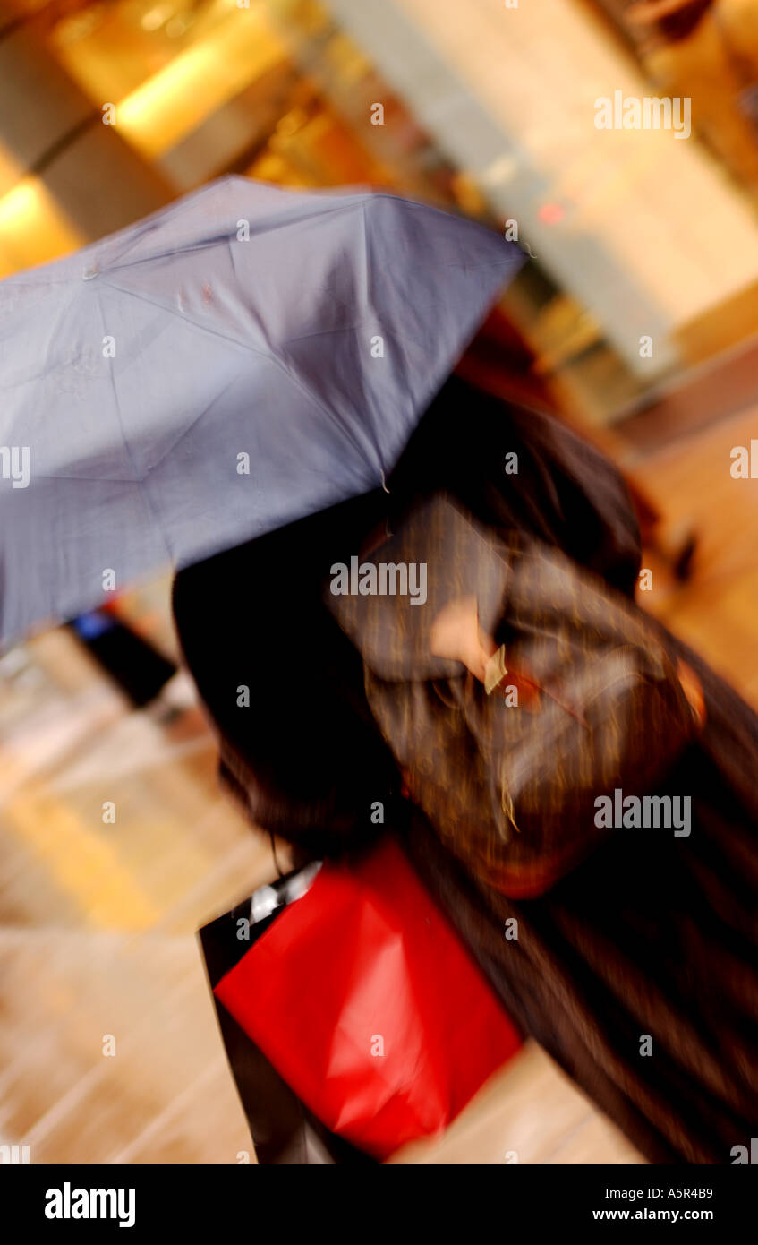 Shopping in the rain hi-res stock photography and images - Alamy