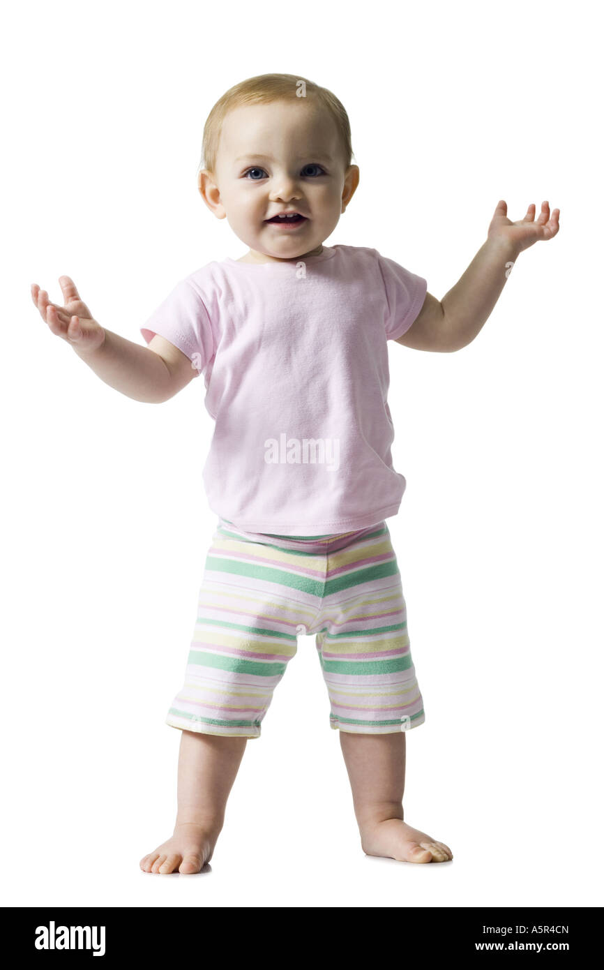 Baby Girl standing Stock Photo - Alamy