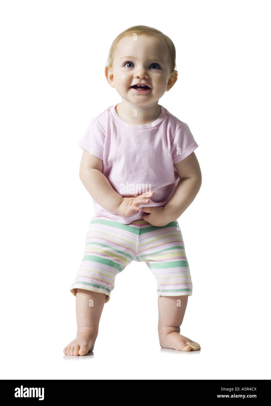 Baby Girl standing Stock Photo - Alamy