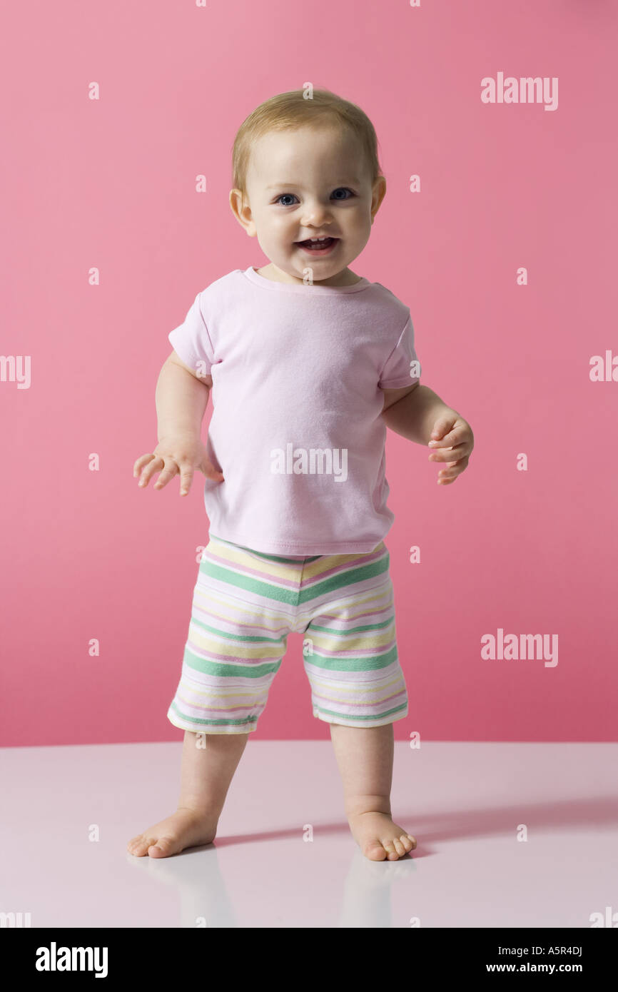 Baby Girl walking Stock Photo - Alamy