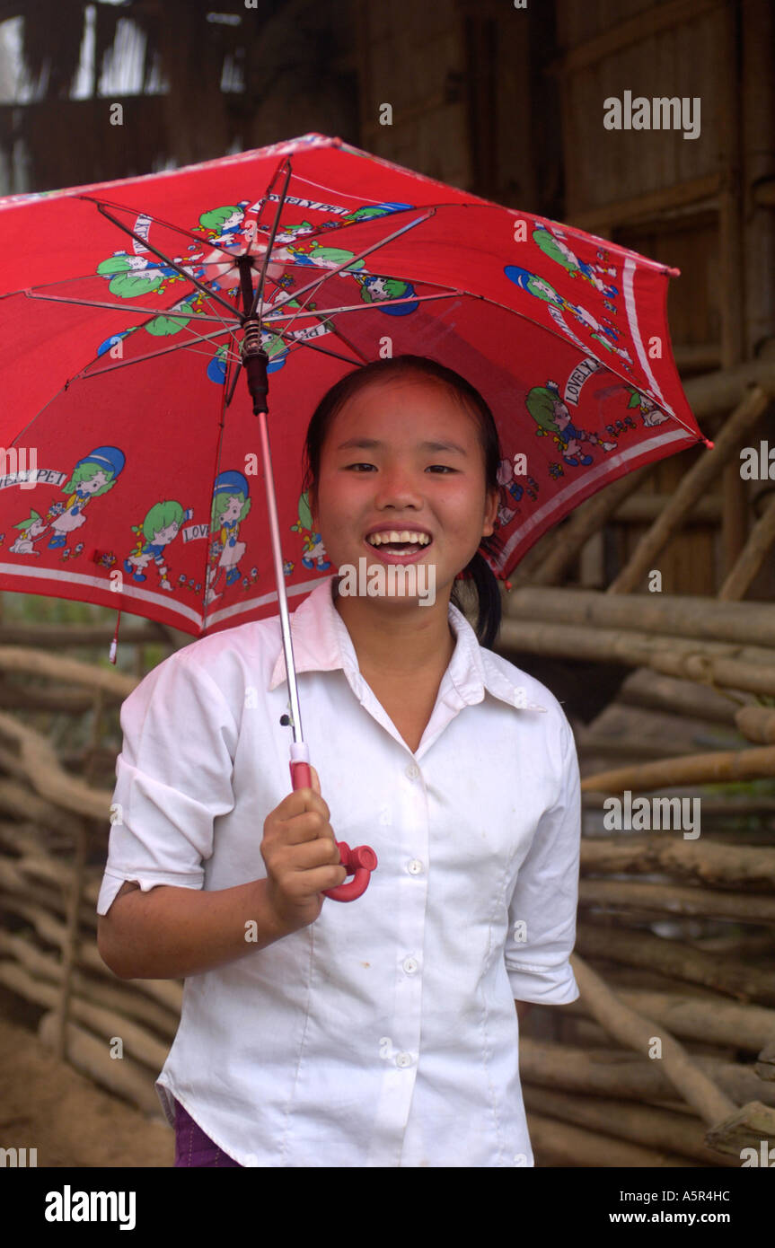 Hmong ethnic minority girl carrying red umbrella Luang Prabang Province ...