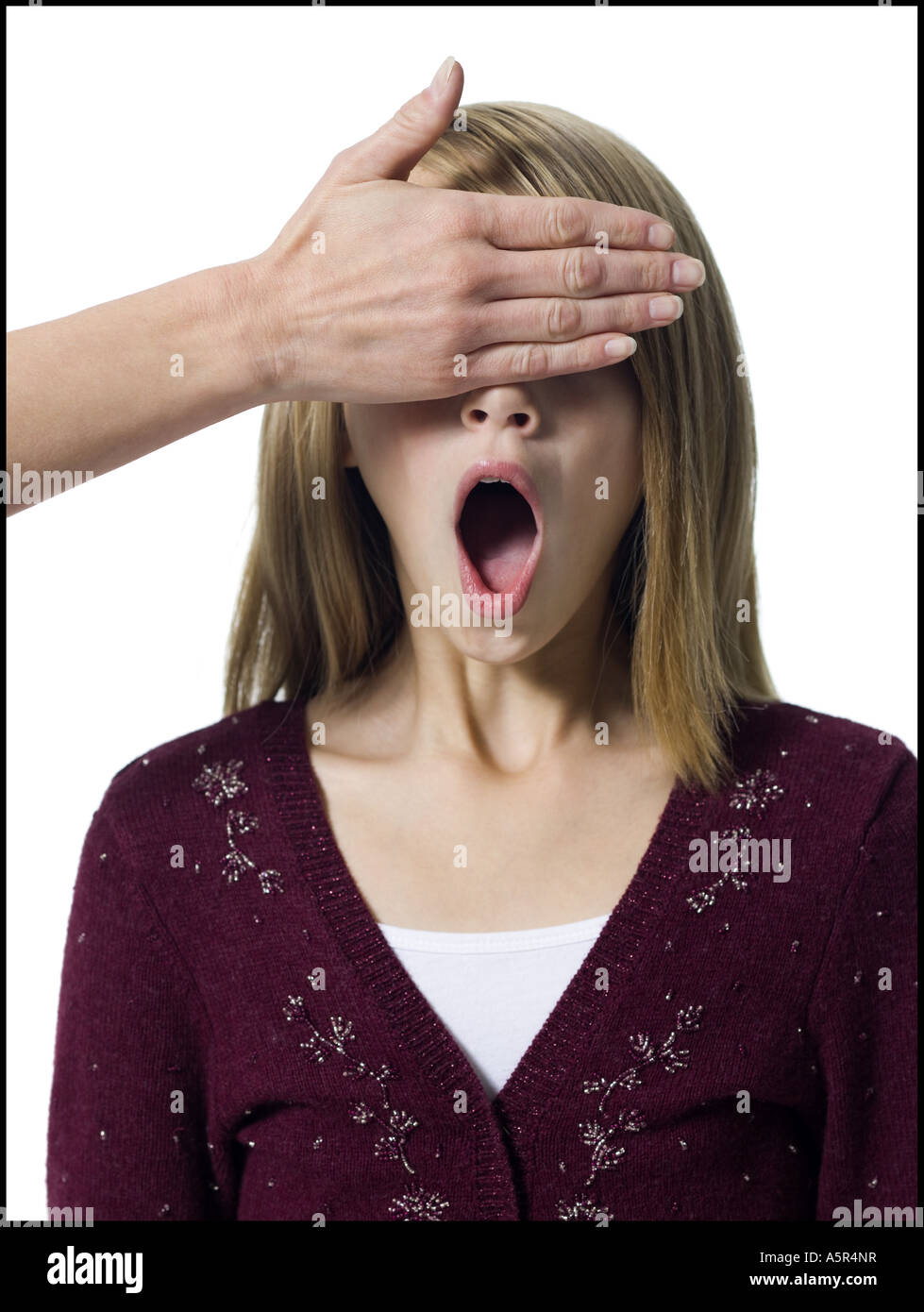 Girl with hand over eyes Stock Photo - Alamy