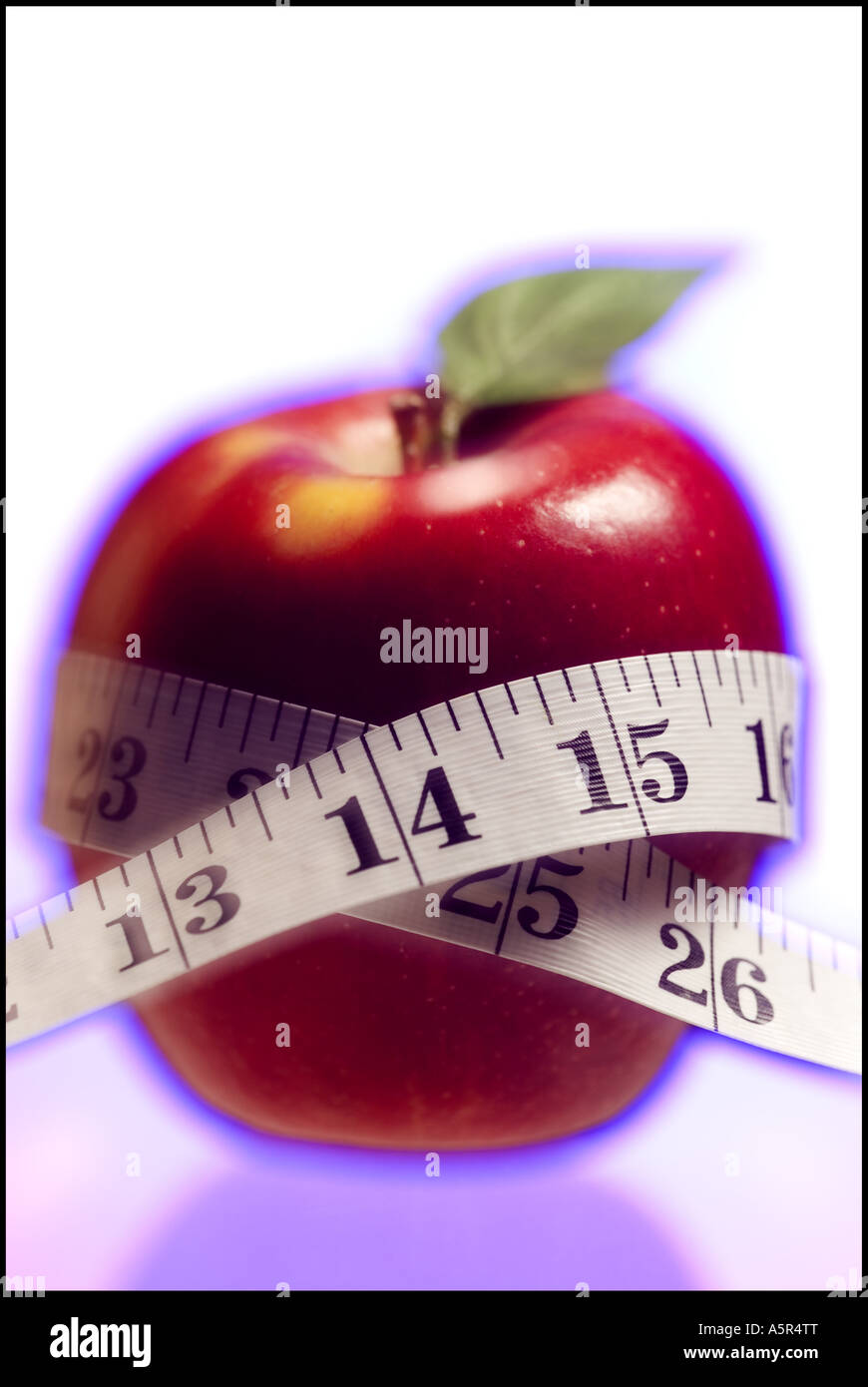 Close up of a tape measure around an apple Stock Photo - Alamy