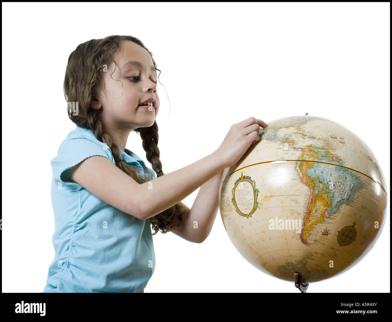 Profile of a girl looking at a globe Stock Photo - Alamy