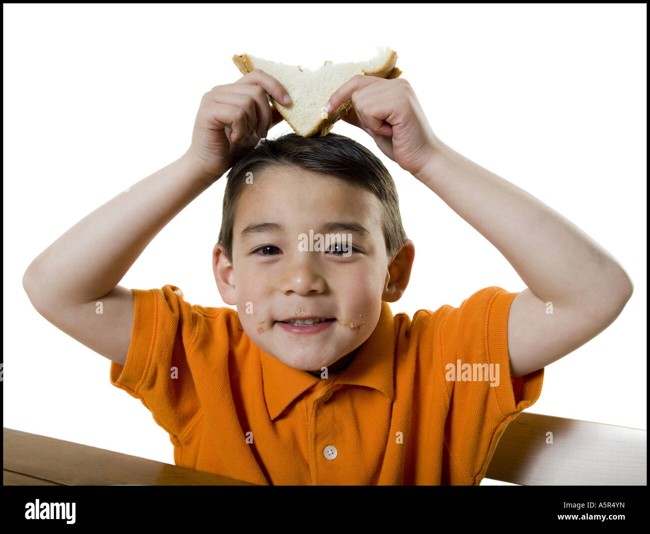 Portrait of a boy eating a sandwich Stock Photo - Alamy