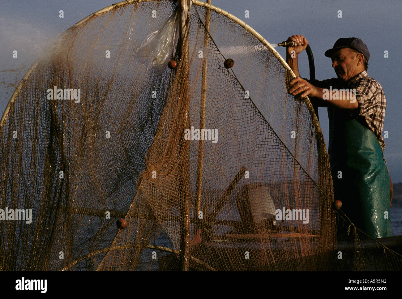 ITALIAN FOOD ARISTIDE FISHING WASHING HIS NETS ON LAKE TRANSIMENO ...