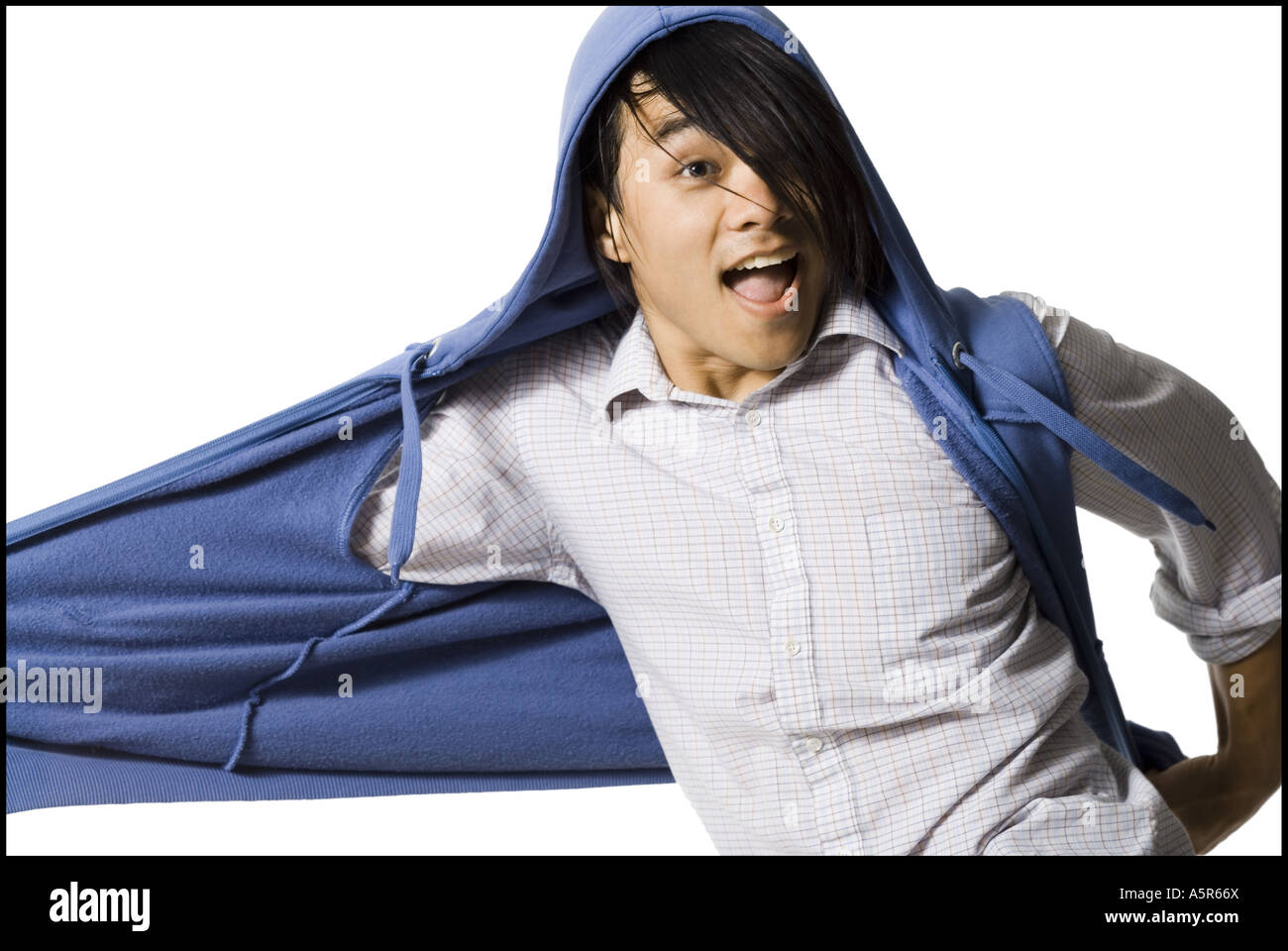 Man in hoodie dancing and smiling Stock Photo - Alamy