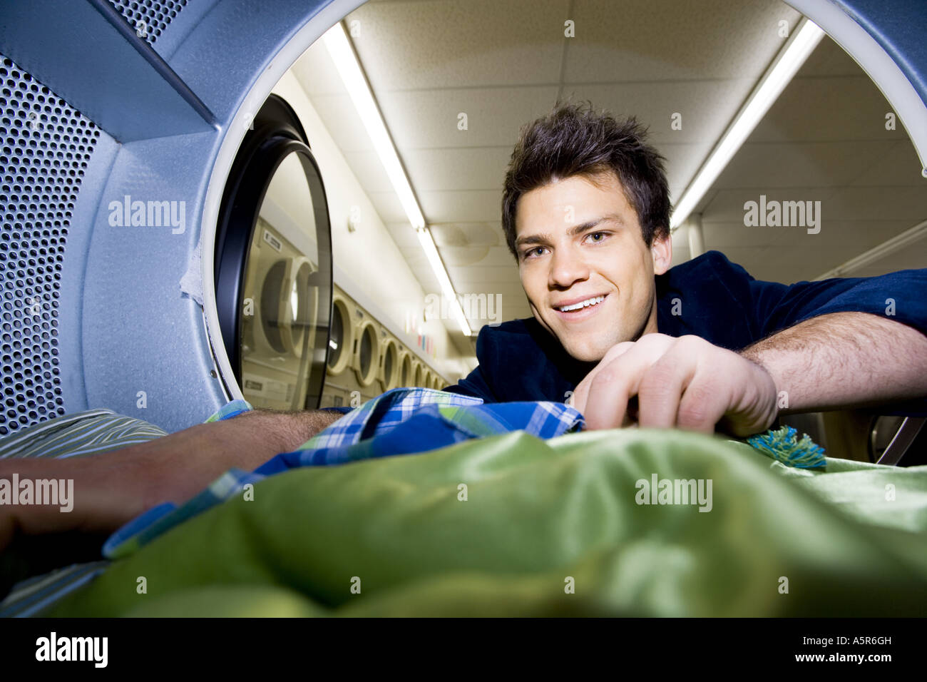 Man inside dryer laundromat clothing hi-res stock photography and ...