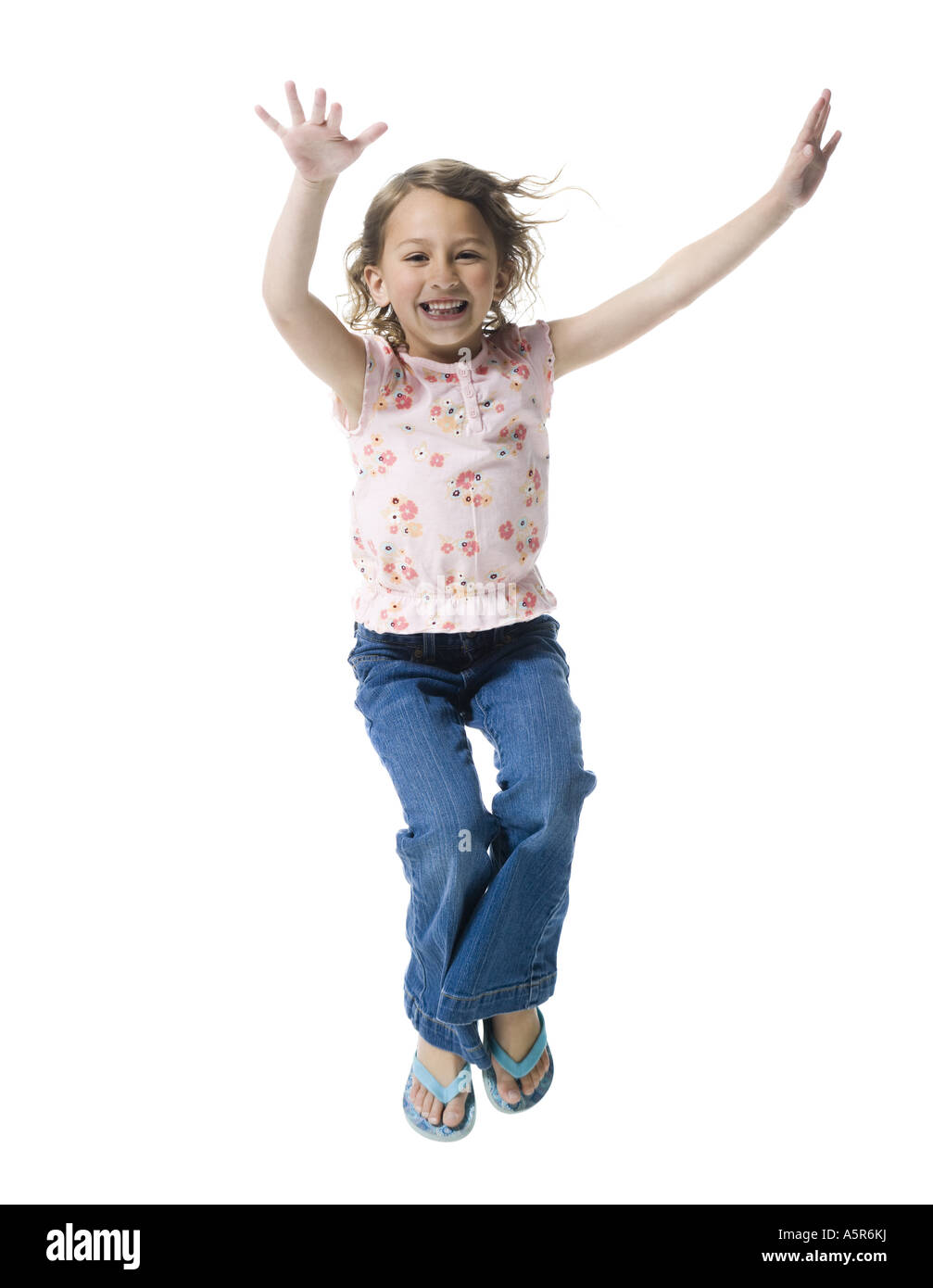 Portrait of a girl jumping with joy Stock Photo - Alamy