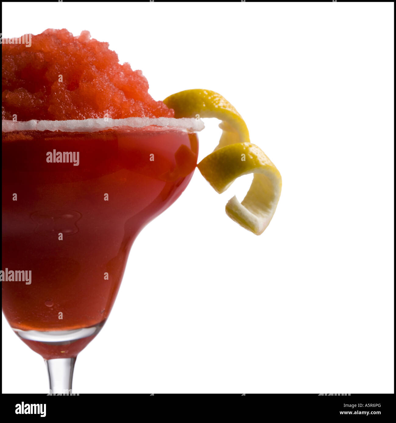 Red slush beverage in cocktail glass with lemon garnish Stock Photo - Alamy