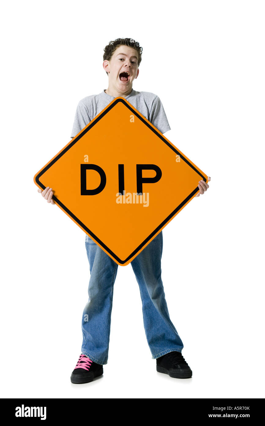 Portrait of a teenage boy holding a sign board Stock Photo - Alamy