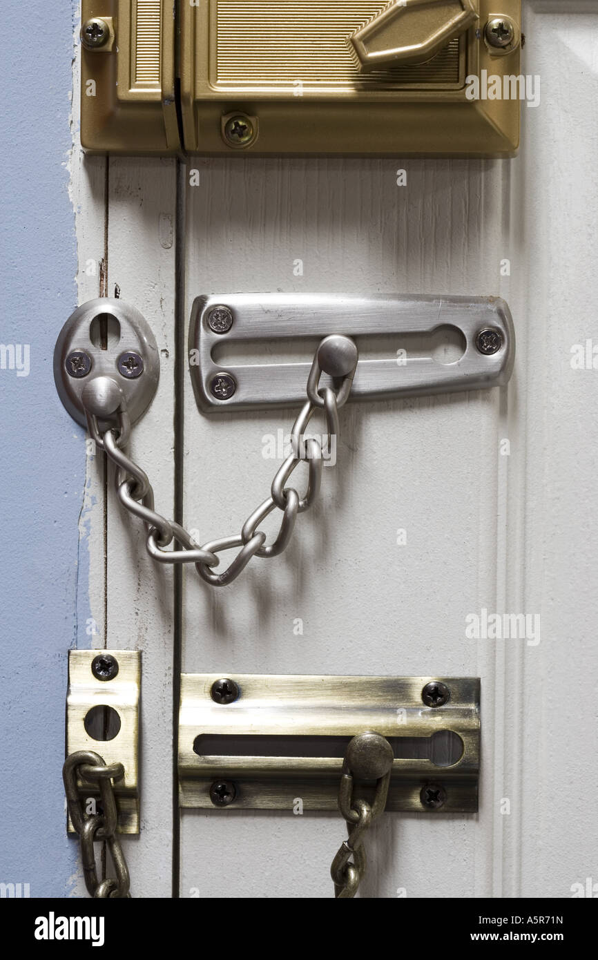 Three locks on door Stock Photo - Alamy