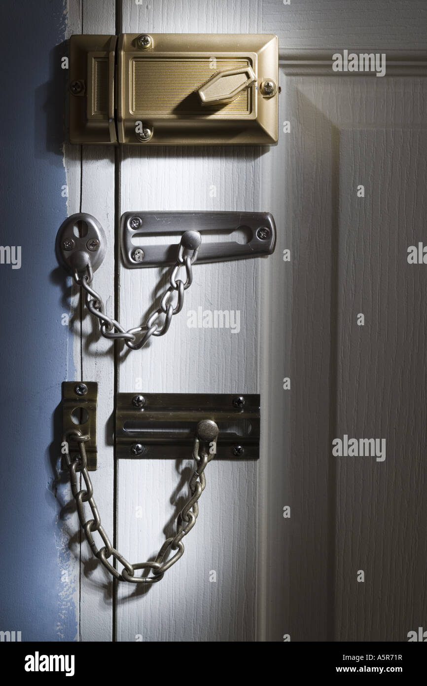 Three locks on door Stock Photo - Alamy