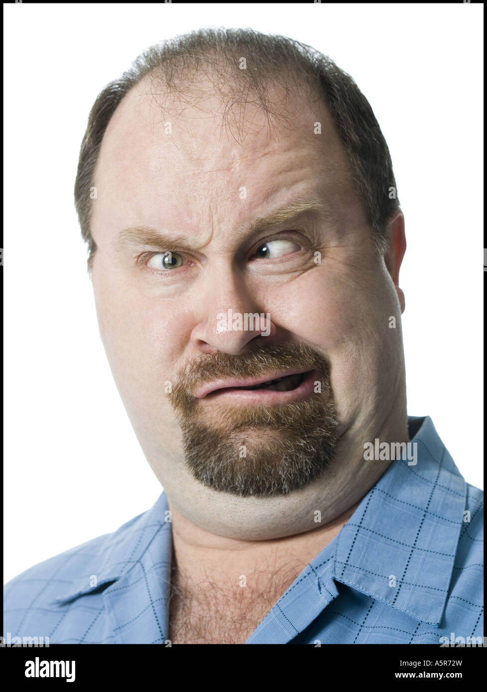 Portrait of a mature man looking worried Stock Photo - Alamy