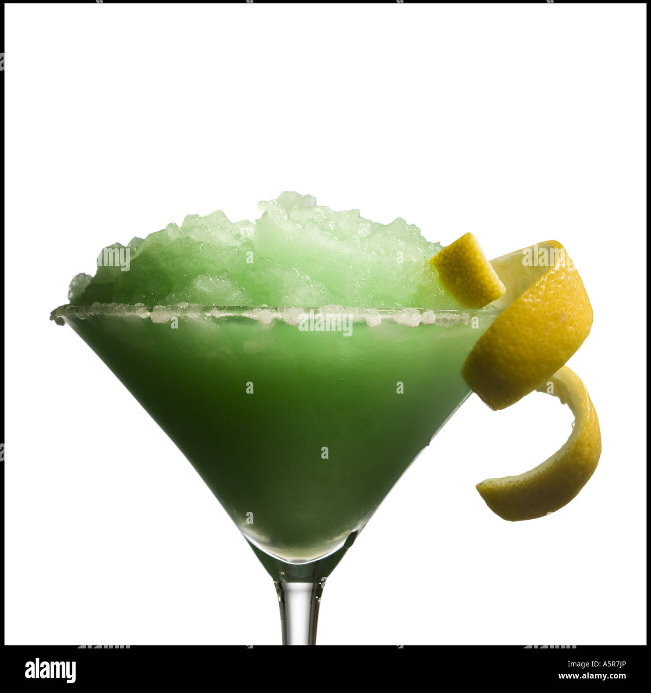 Green slush beverage in cocktail glass with lemon garnish Stock Photo ...