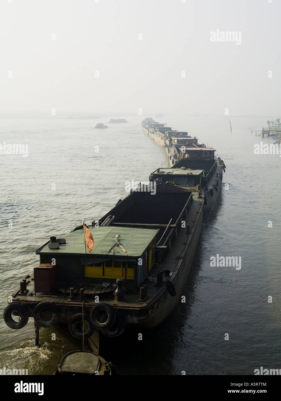 Line up of boats in water Stock Photo - Alamy