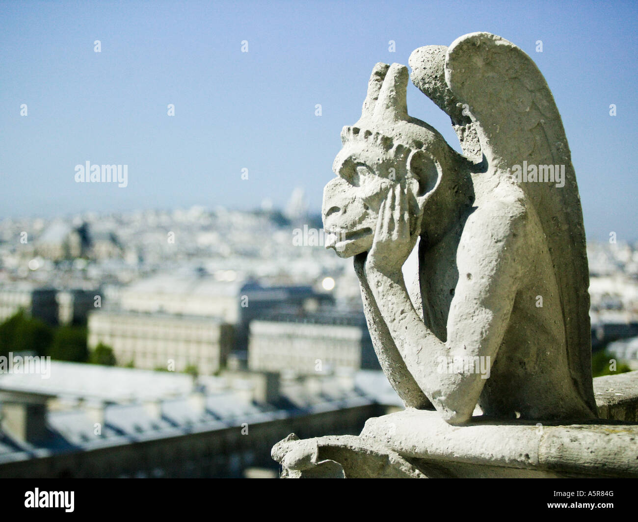 Gargoyle atop building Stock Photo - Alamy