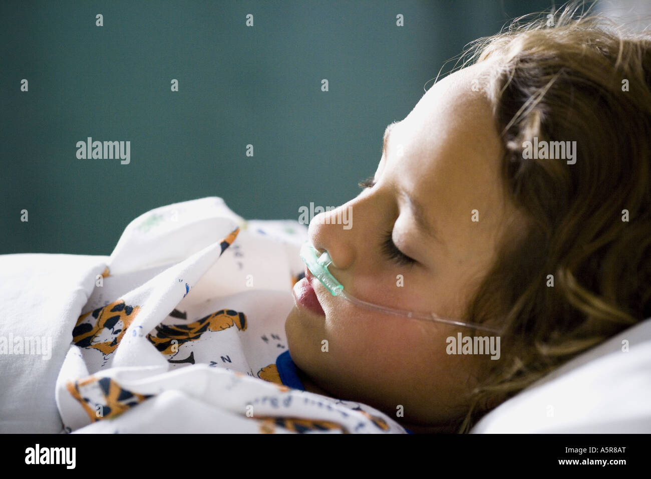 Young girl in hospital bed with respirator Stock Photo - Alamy