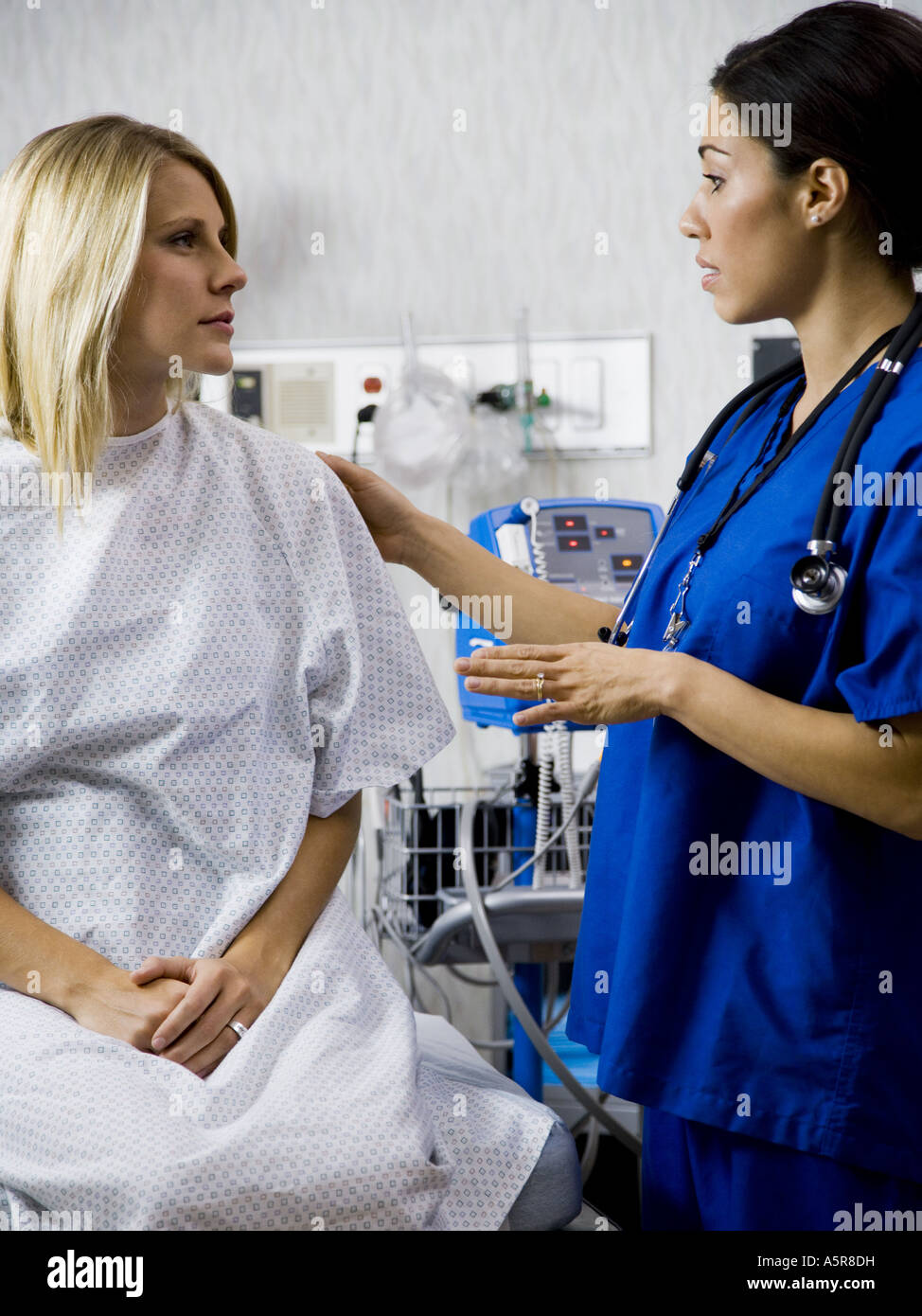 Female patient with nurse at examination Stock Photo - Alamy