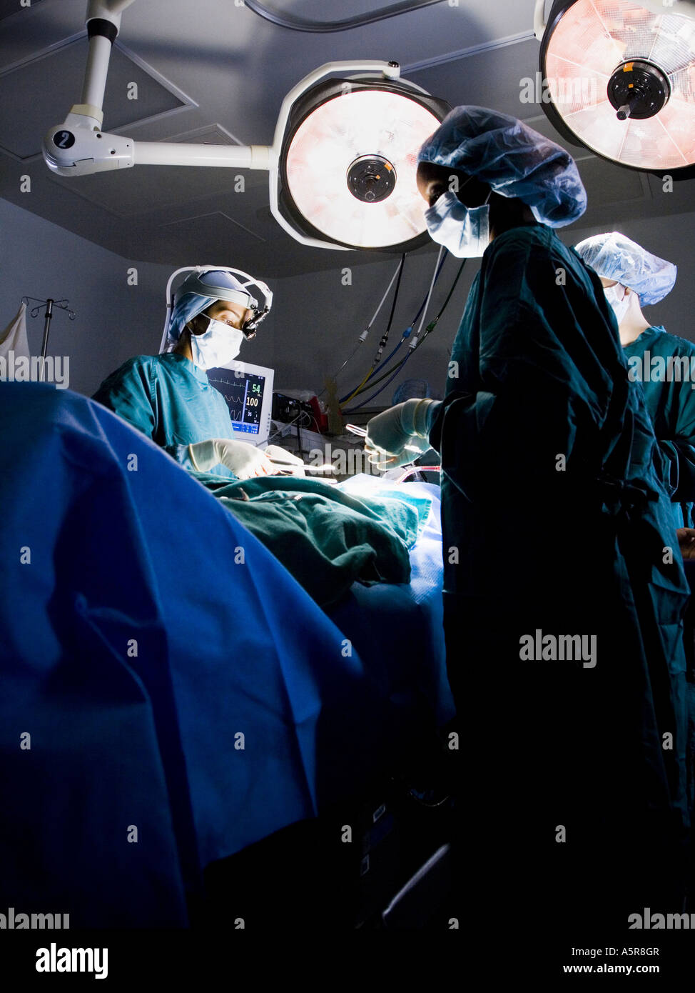 Female nurse and surgeon in scrubs during surgery Stock Photo - Alamy