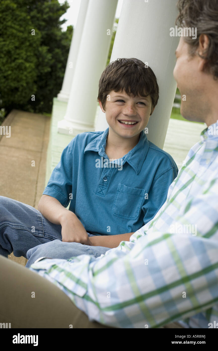 Close up of a boy and his father smiling Stock Photo - Alamy