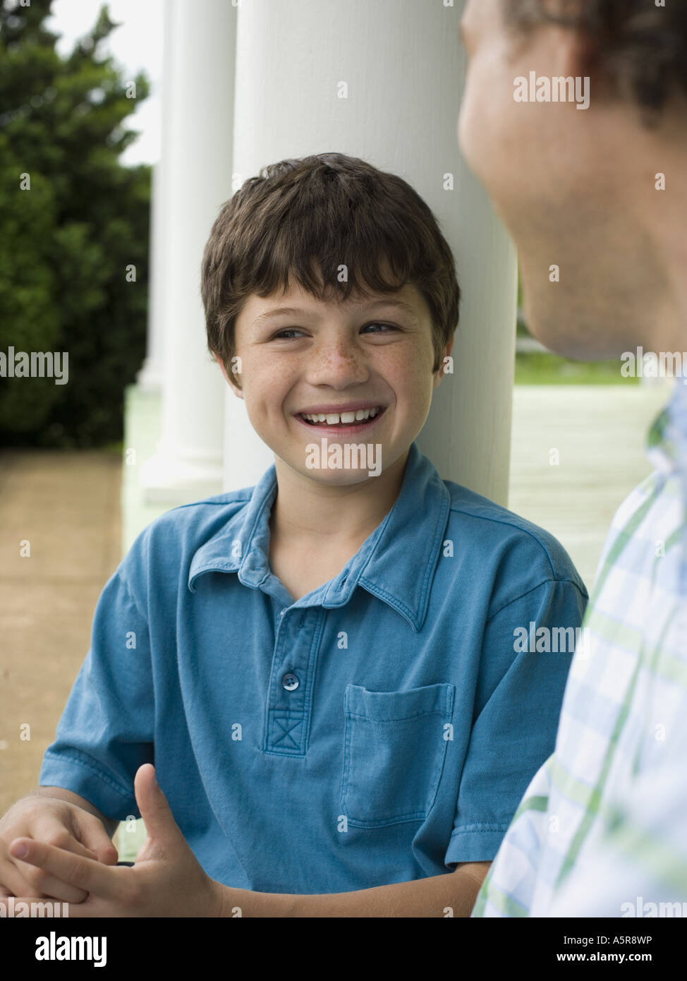 Close up of a boy and his father smiling Stock Photo - Alamy