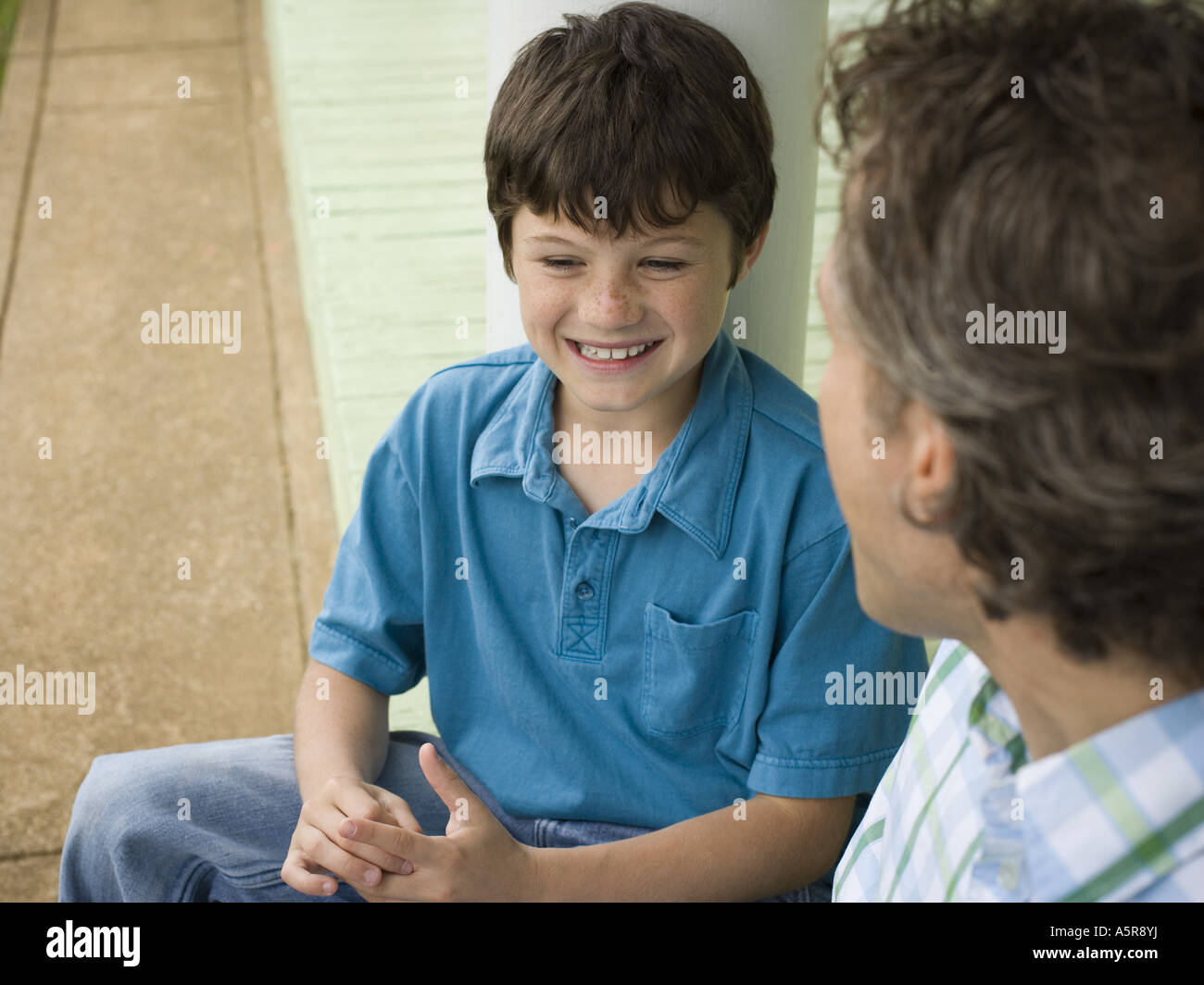Close up of a boy and his father smiling Stock Photo - Alamy