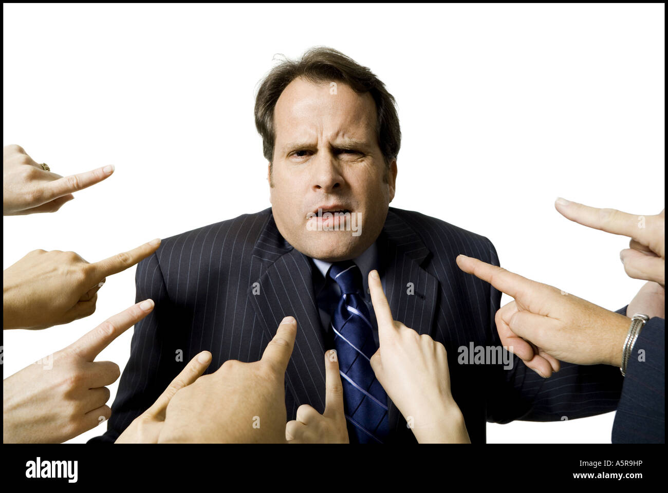 Businessman with fingers pointing at him Stock Photo - Alamy