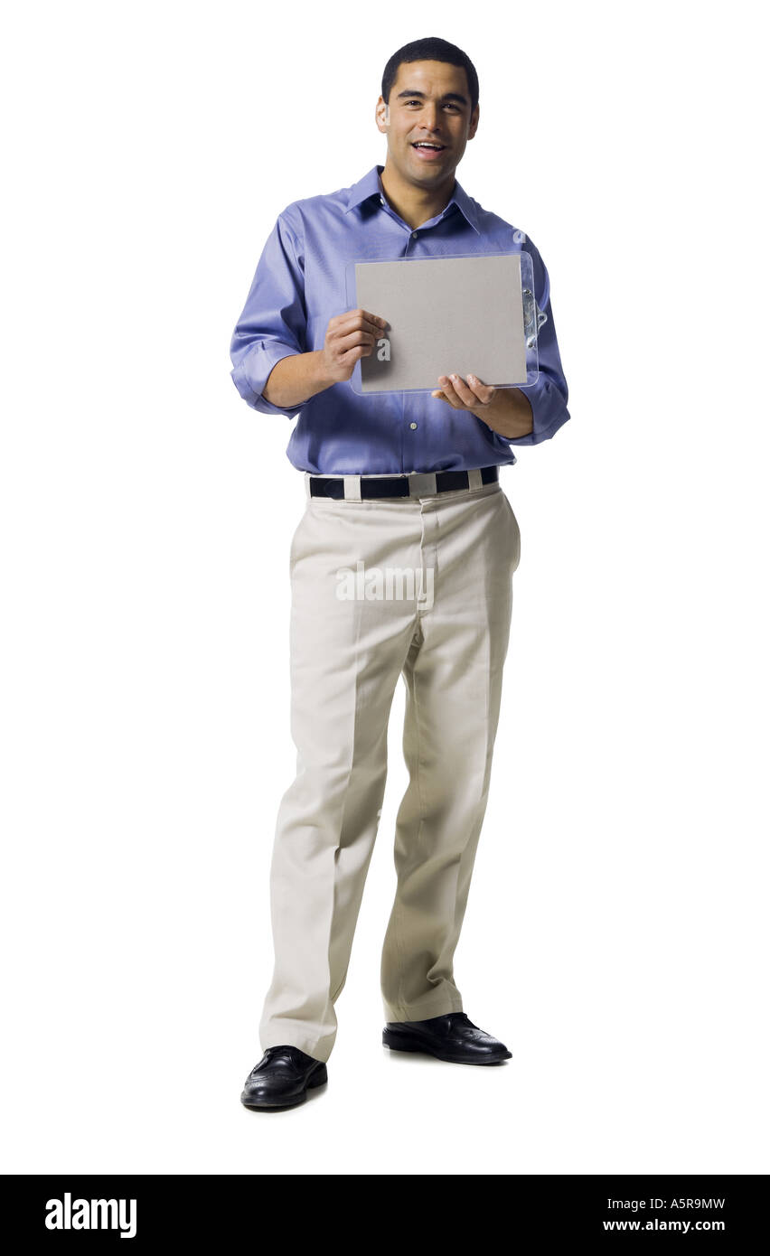 Man standing with blank sign smiling Stock Photo - Alamy